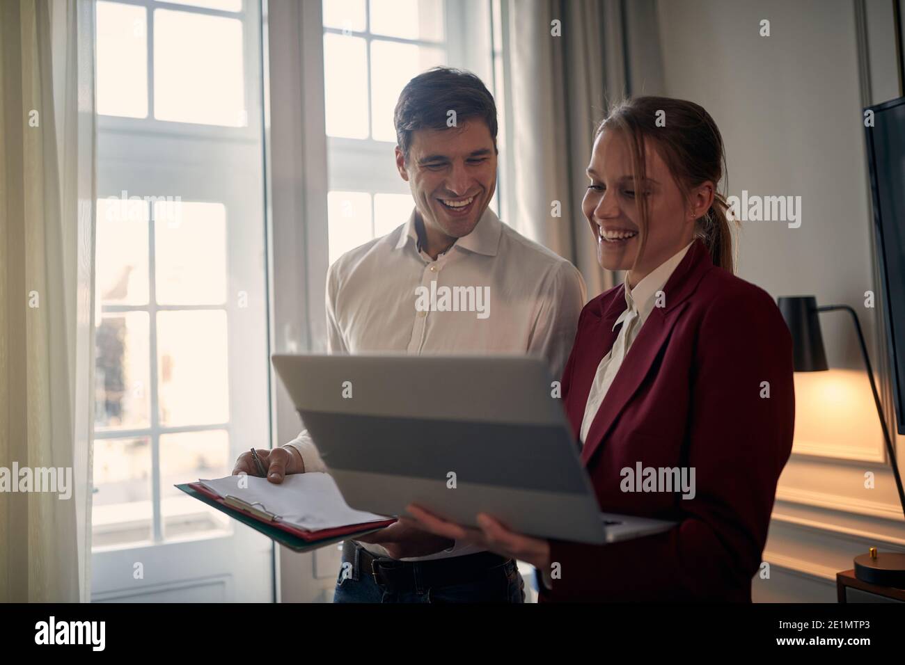 Young modern couple preparing for a business meeting together Stock ...