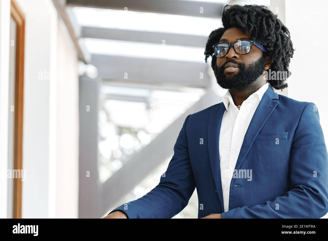 Portrait of african american businessman standing in hotel lobby Stock ...