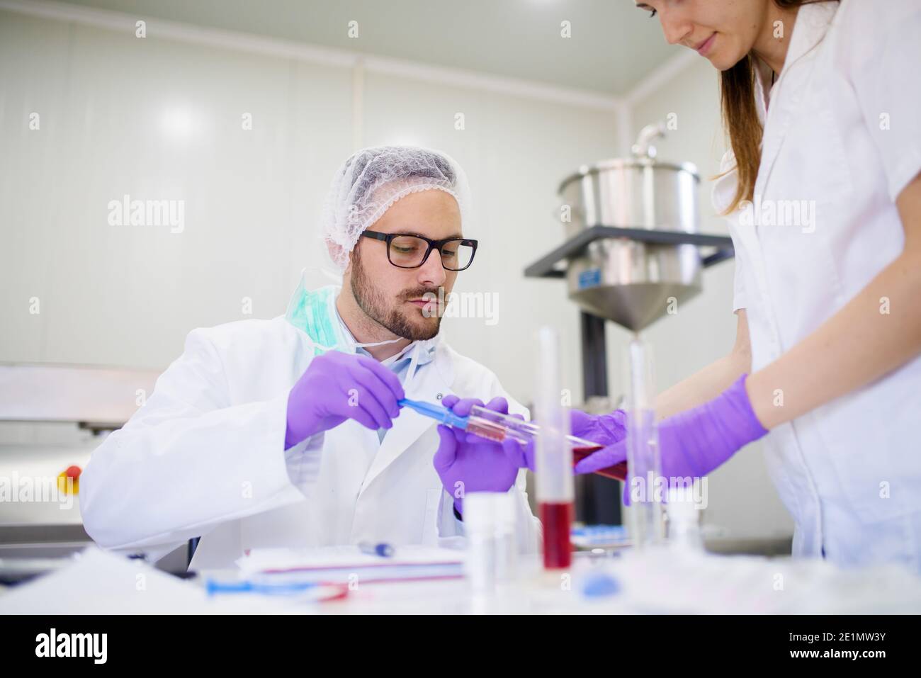 Lab employee working on some product tests Stock Photo - Alamy