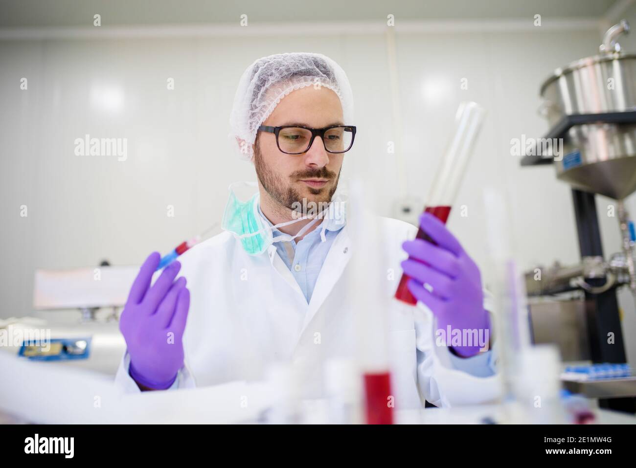 Lab employee working on some product tests Stock Photo - Alamy