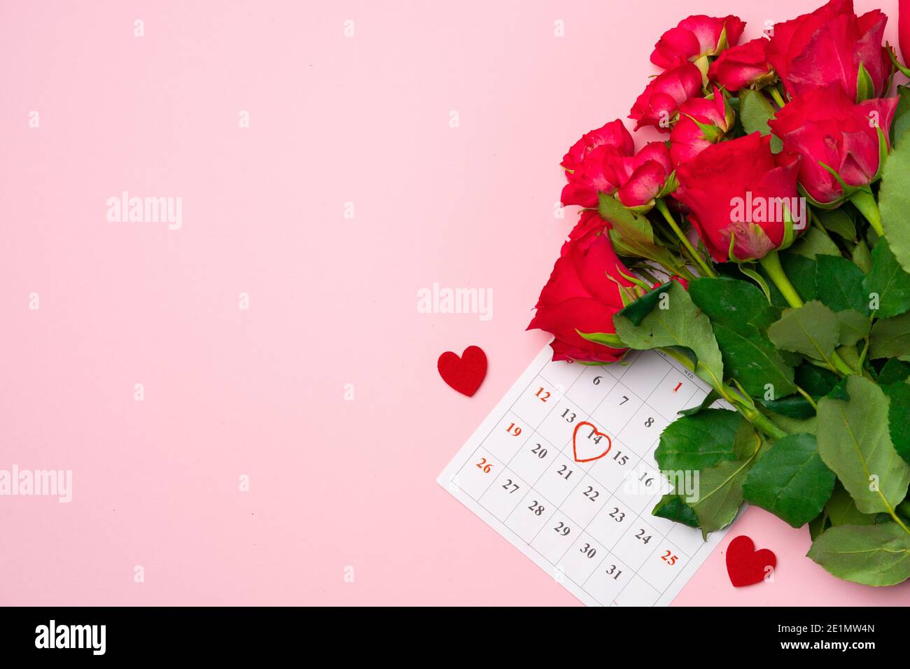 February calendar and red roses top view Stock Photo - Alamy
