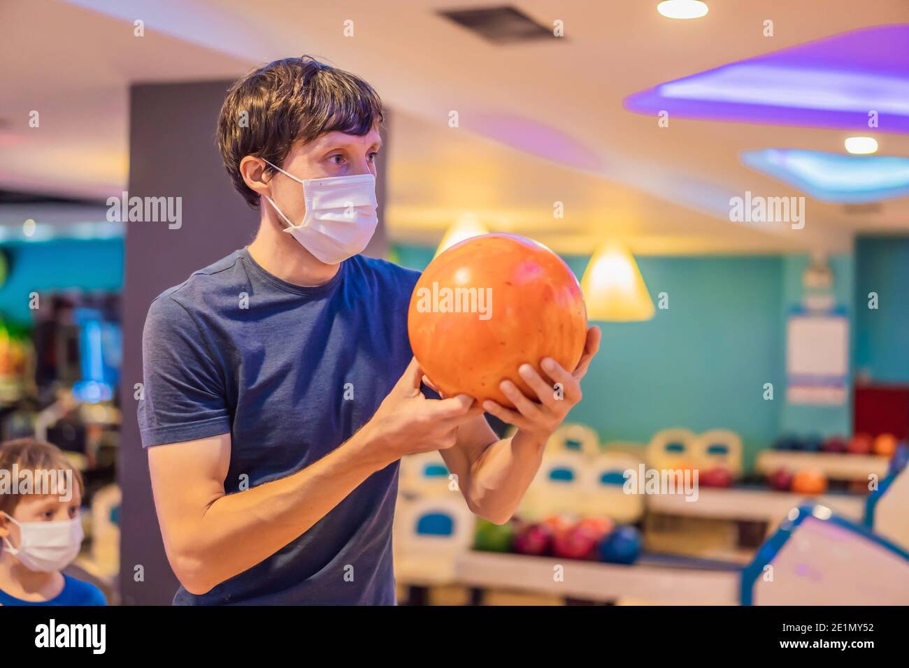 Man playing bowling with medical masks during COVID-19 coronavirus in ...