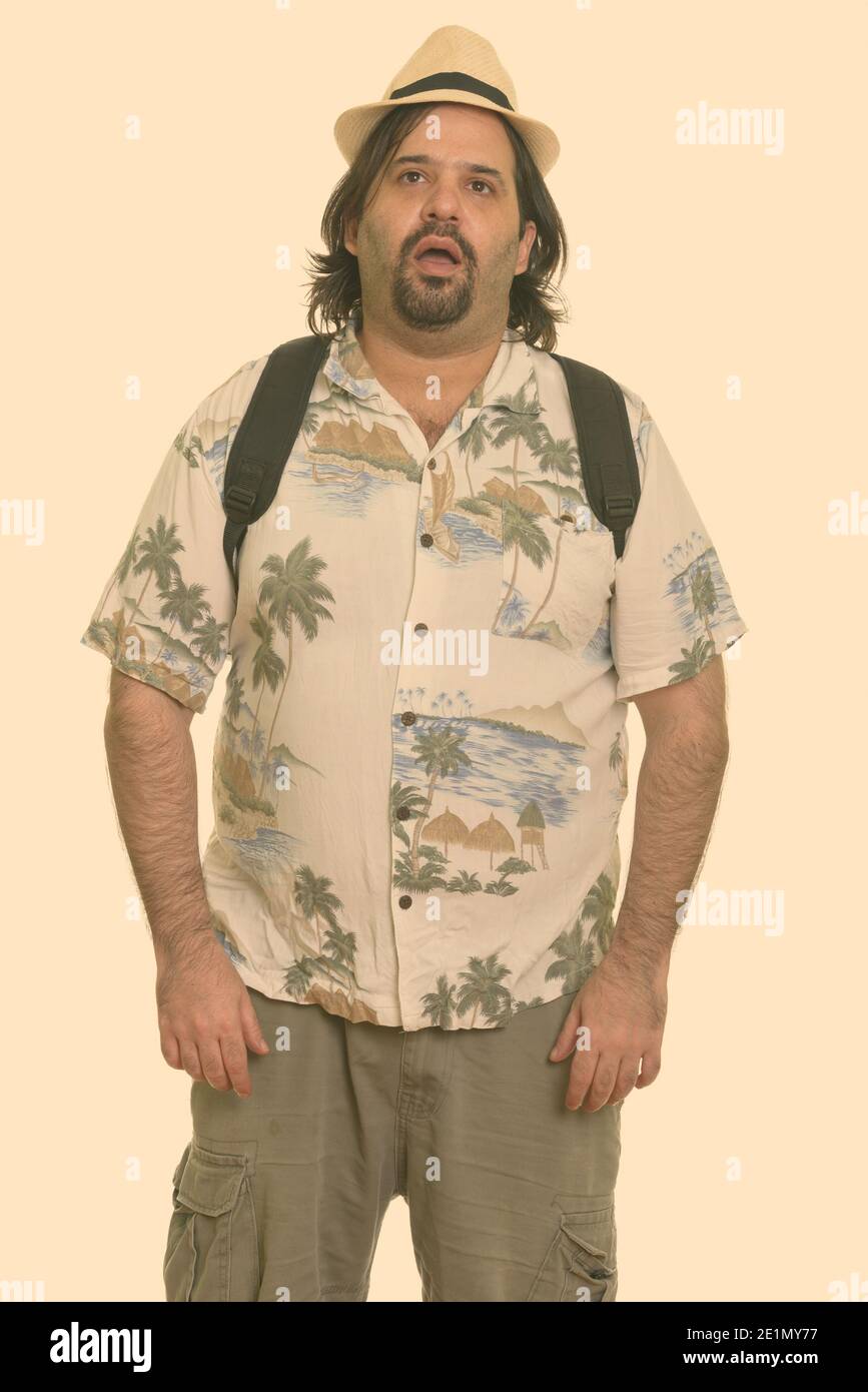Fat Caucasian man looking shocked ready for vacation Stock Photo - Alamy