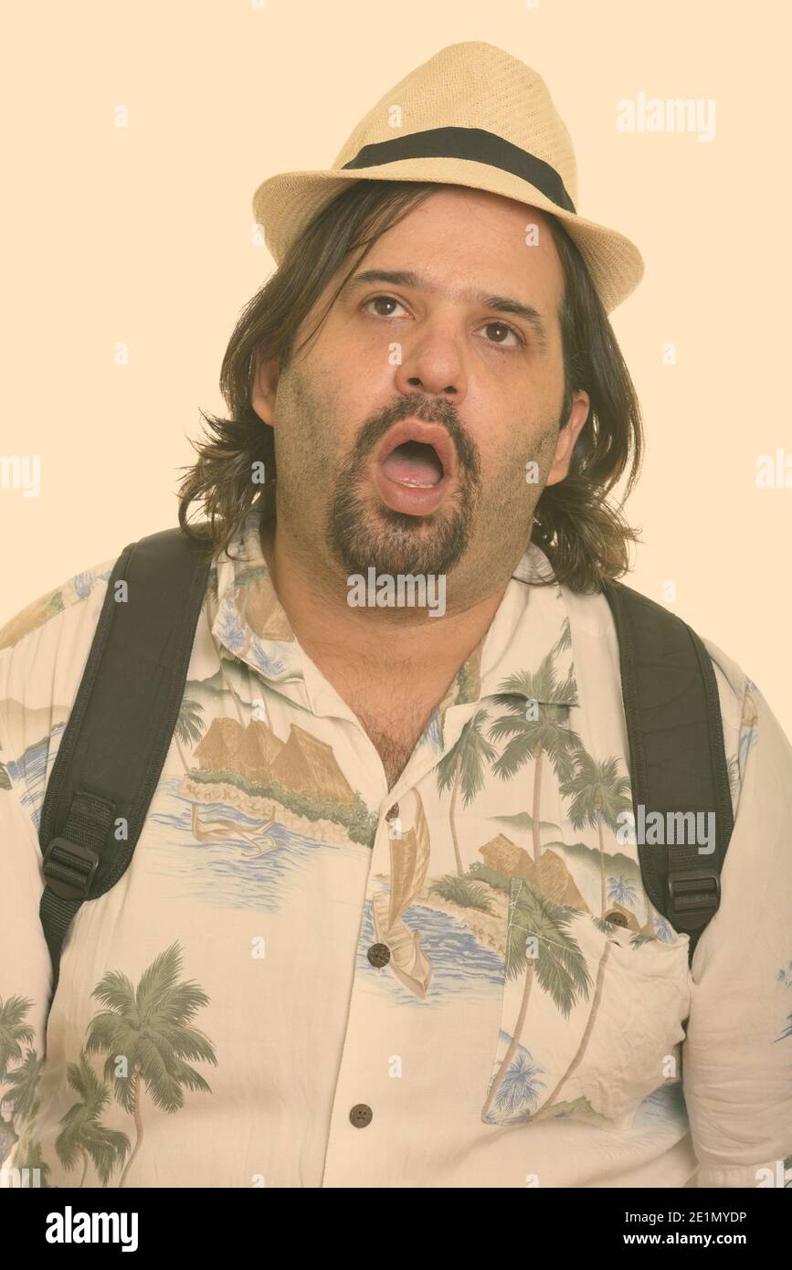 Fat Caucasian man looking shocked ready for vacation Stock Photo - Alamy