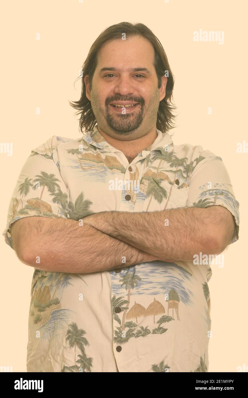Happy fat Caucasian man smiling with arms crossed ready for vacation ...