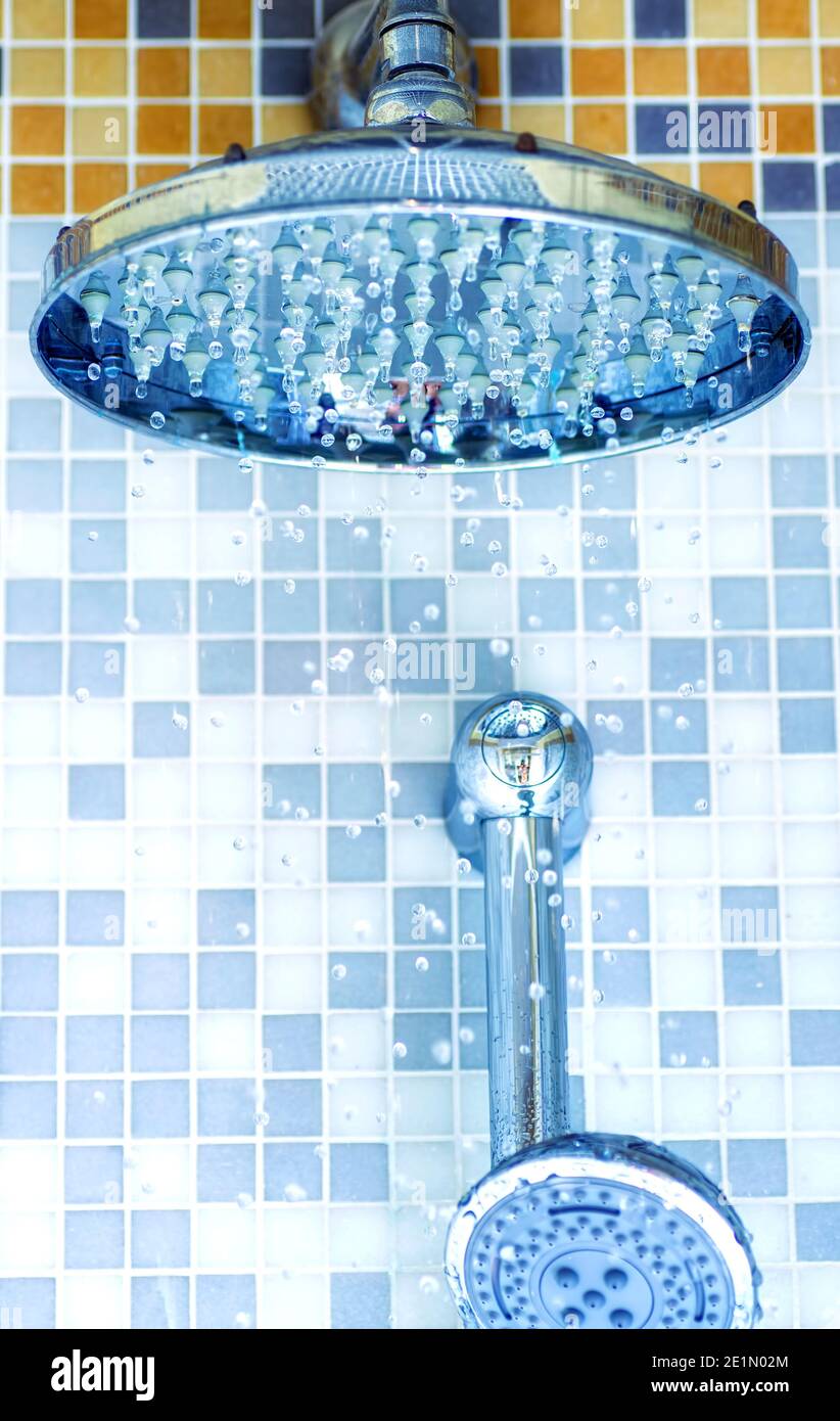 Water sprinkling out of a huge shower head Stock Photo - Alamy
