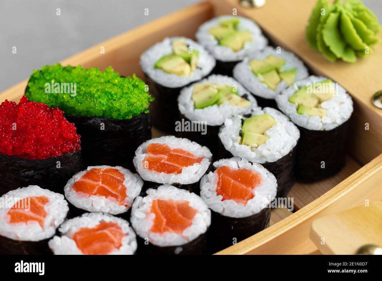 Set of maki sushi on wooden boat tray Stock Photo - Alamy