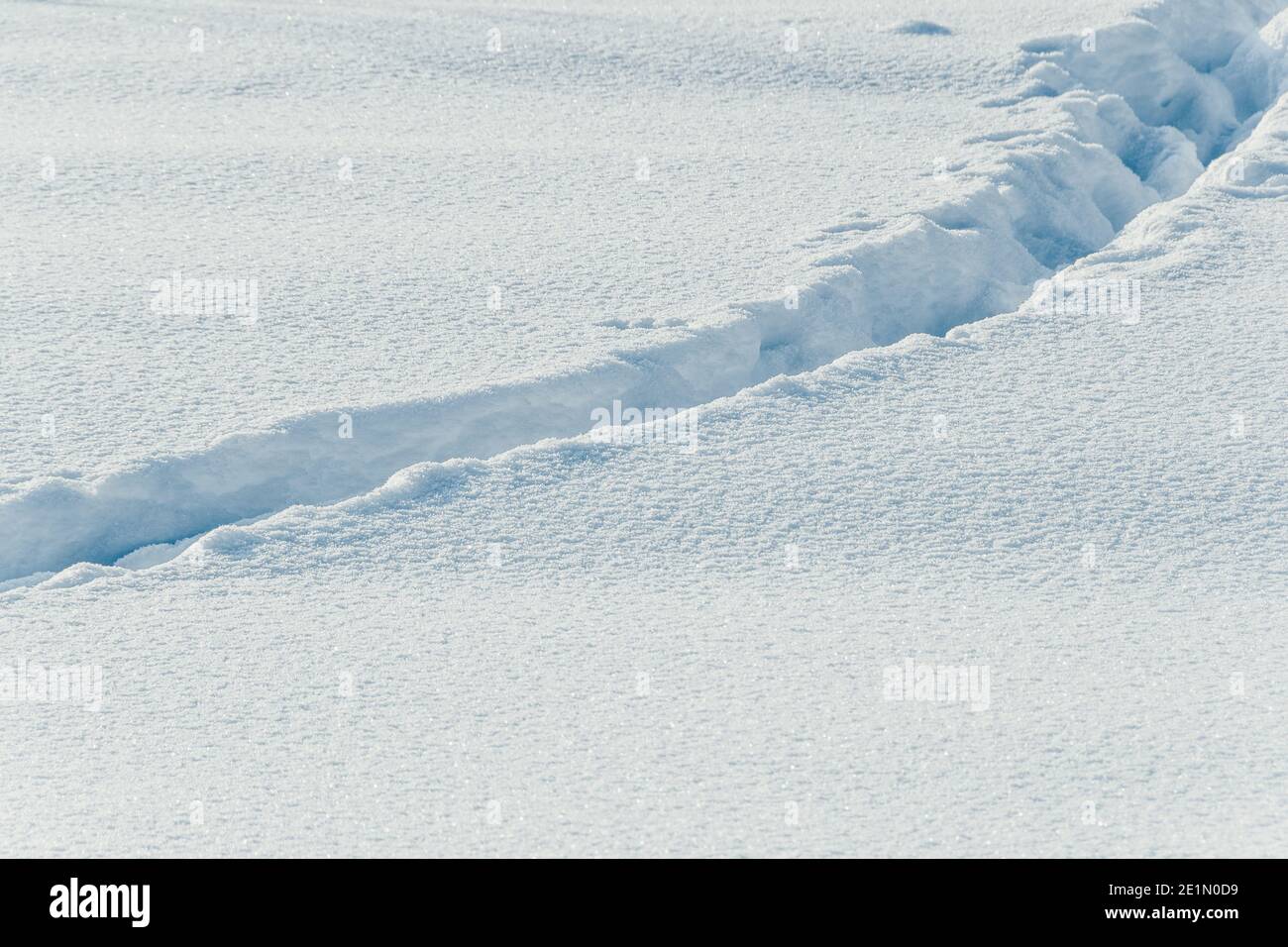 Narrow pathway through deep snow in snow field Stock Photo - Alamy