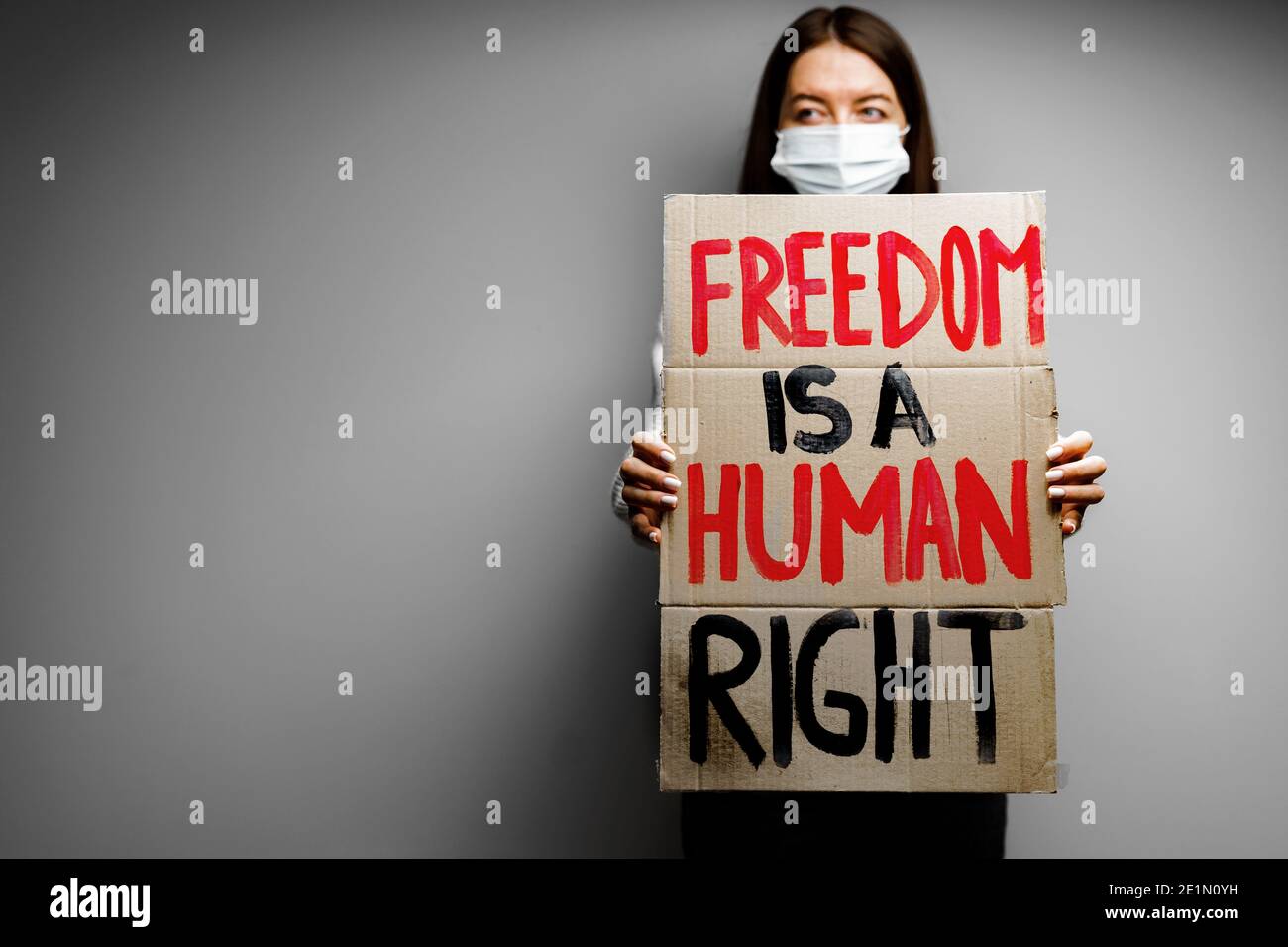 Protest placard 'Freedom is a human right' in hands of a woman Stock ...