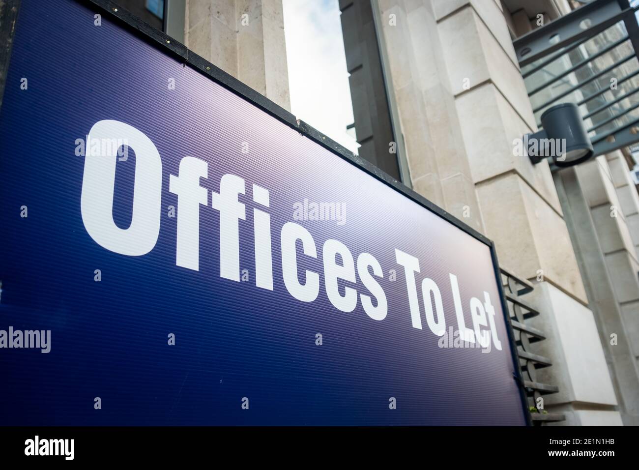 Offices to Let sign in built up city area Stock Photo - Alamy