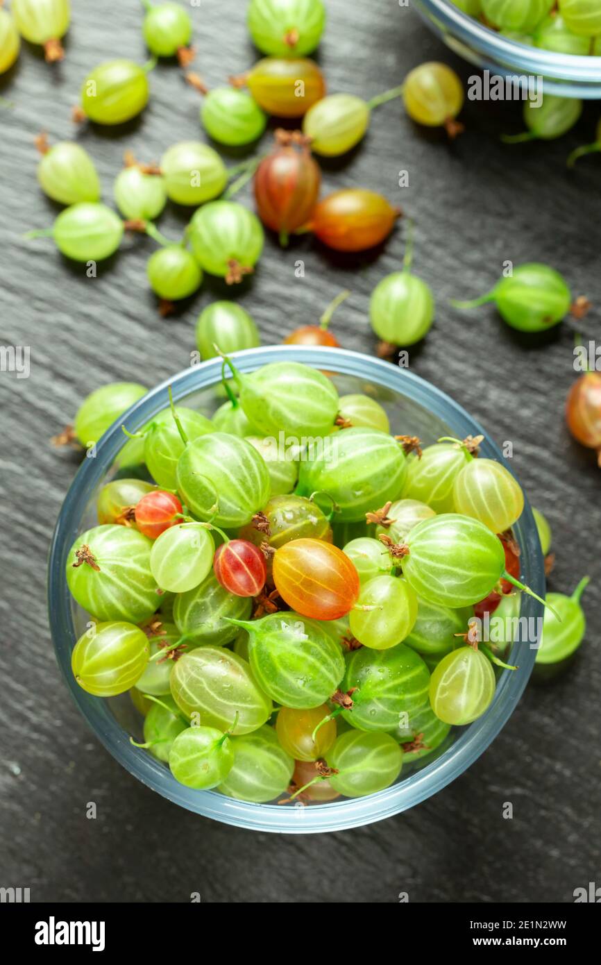 Ripe gooseberry in a glass plate, place for text, top view, summer ...