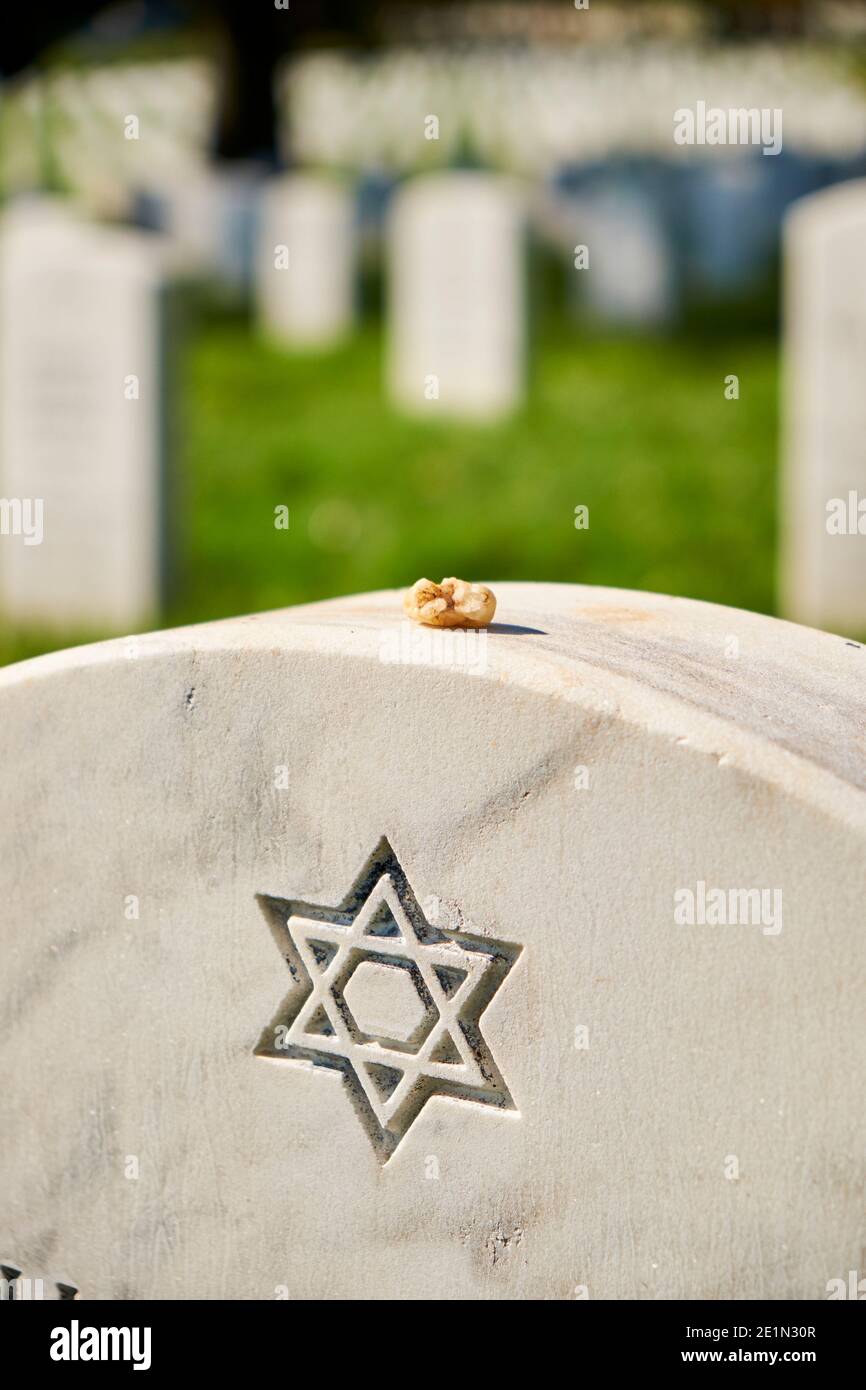 Detail of a stone grave with a Star of David for a Jewish veteran. A ...