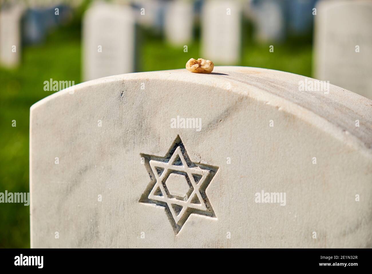 Detail of a stone grave with a Star of David for a Jewish veteran. A ...