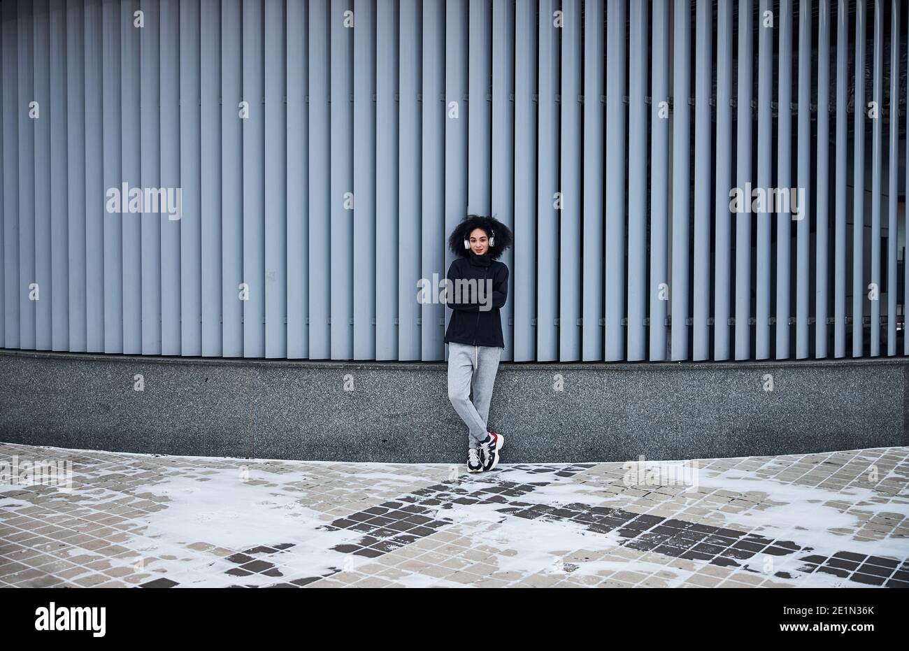 Female resting with crossed arms and legs Stock Photo - Alamy