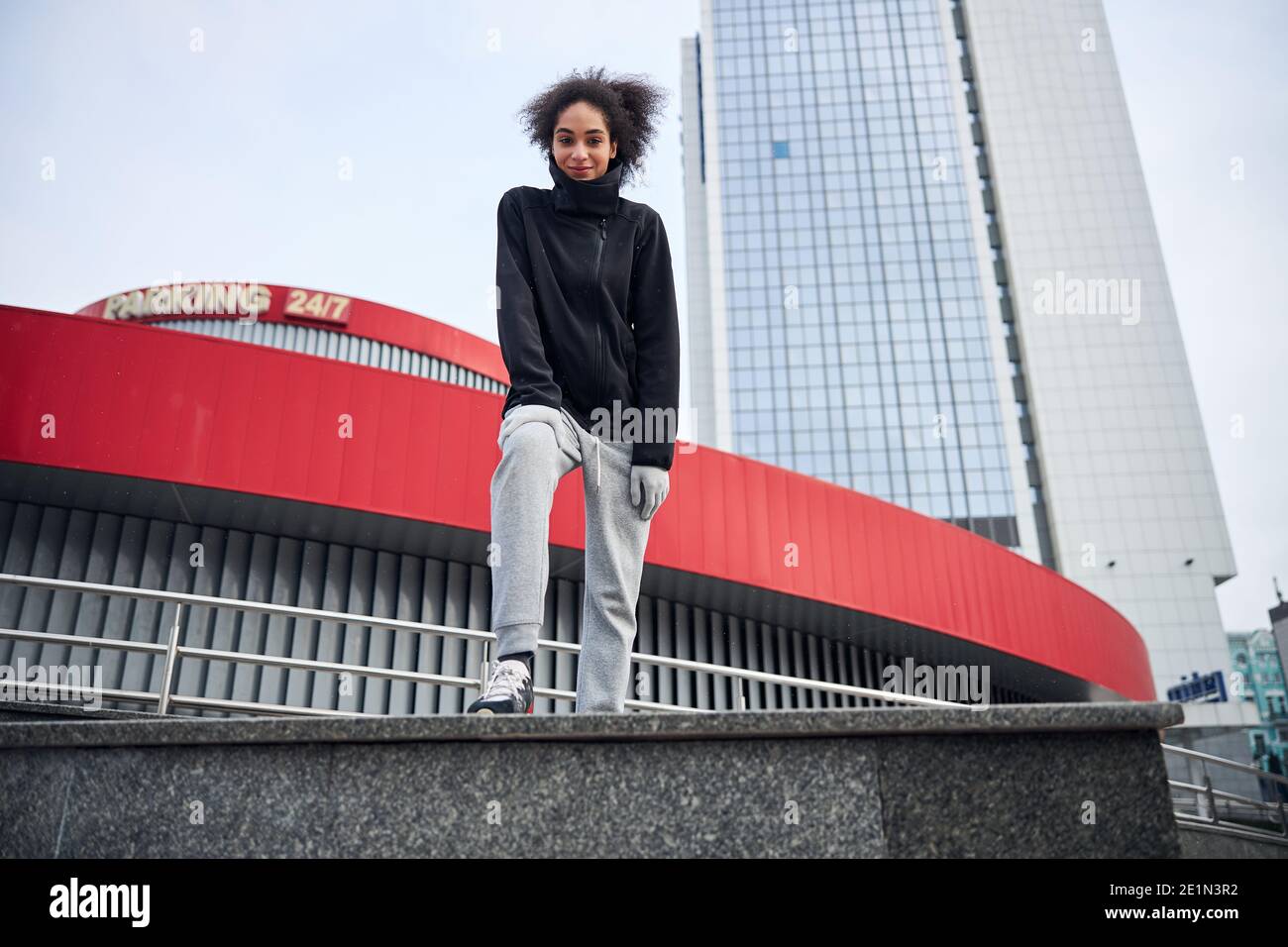 Female looking down from a stone block Stock Photo - Alamy