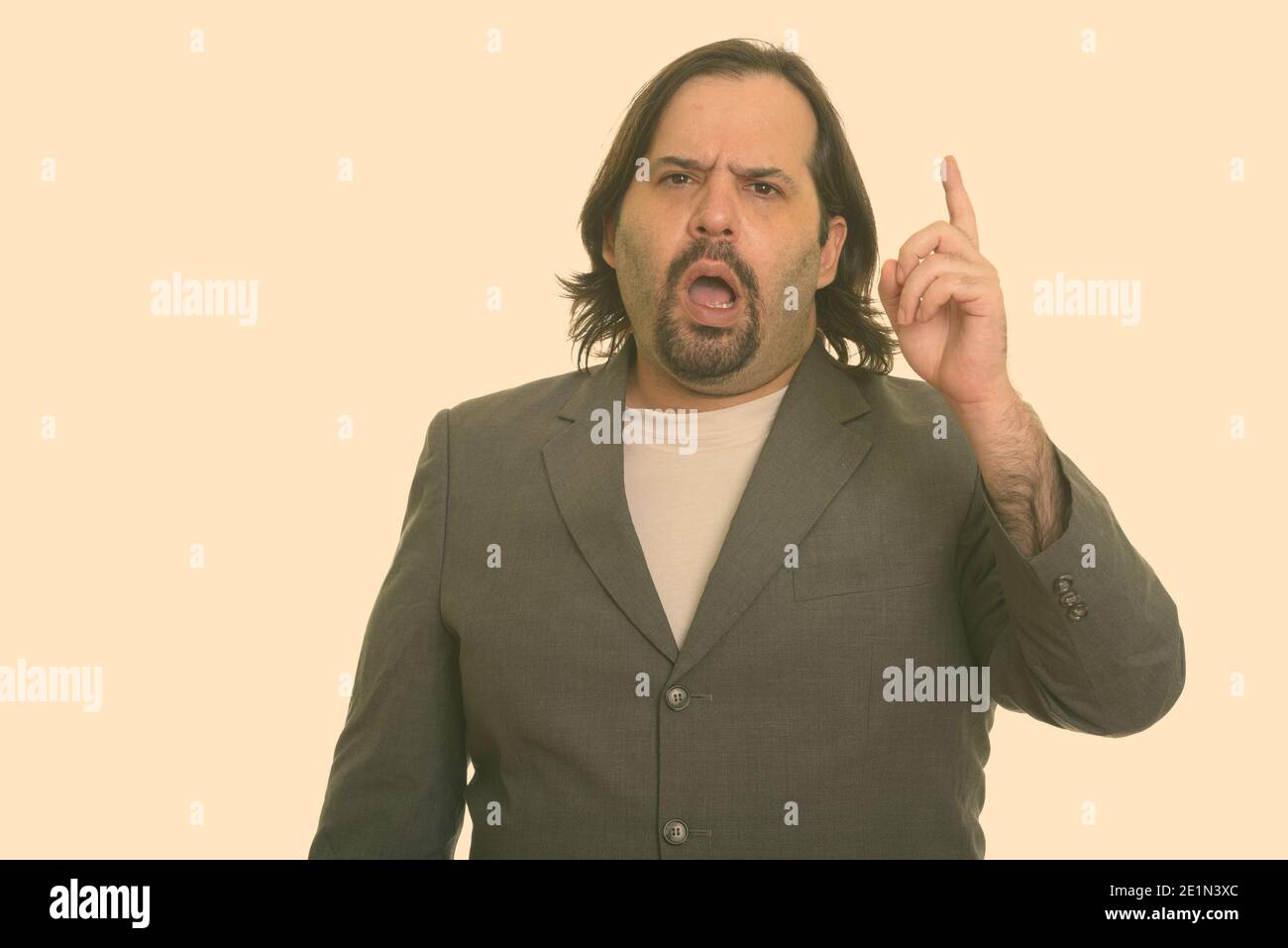 Fat Caucasian businessman looking angry and pointing finger up Stock ...