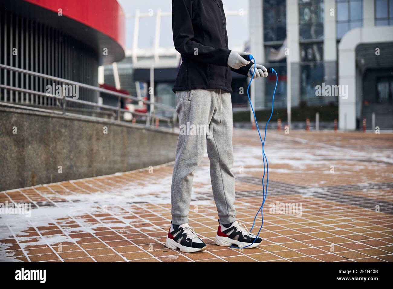 Adult stepping with a shoe on a skip rope Stock Photo - Alamy