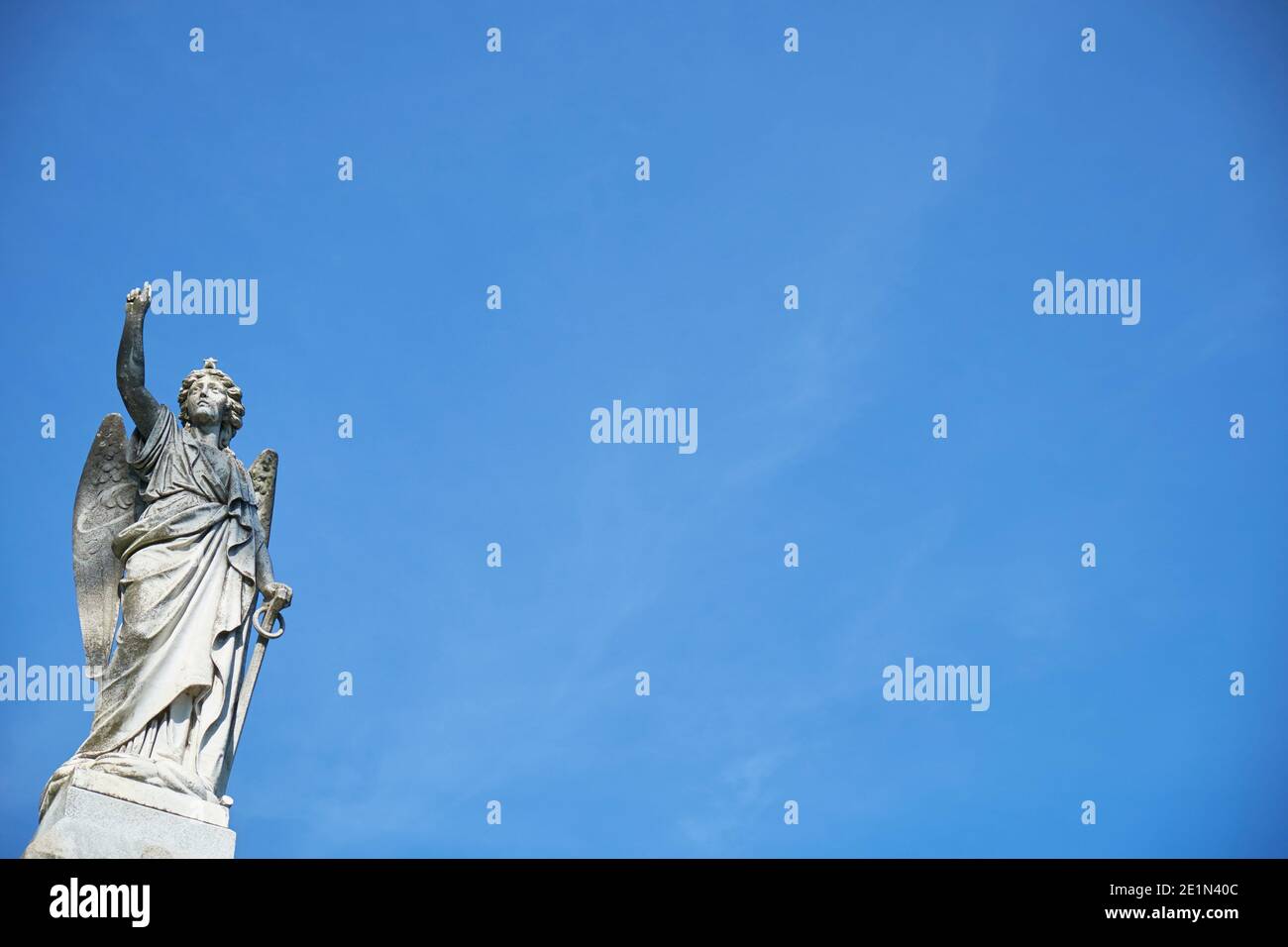 A large stone, pointing, winged angel on top of 1st Lieutenant Robert ...