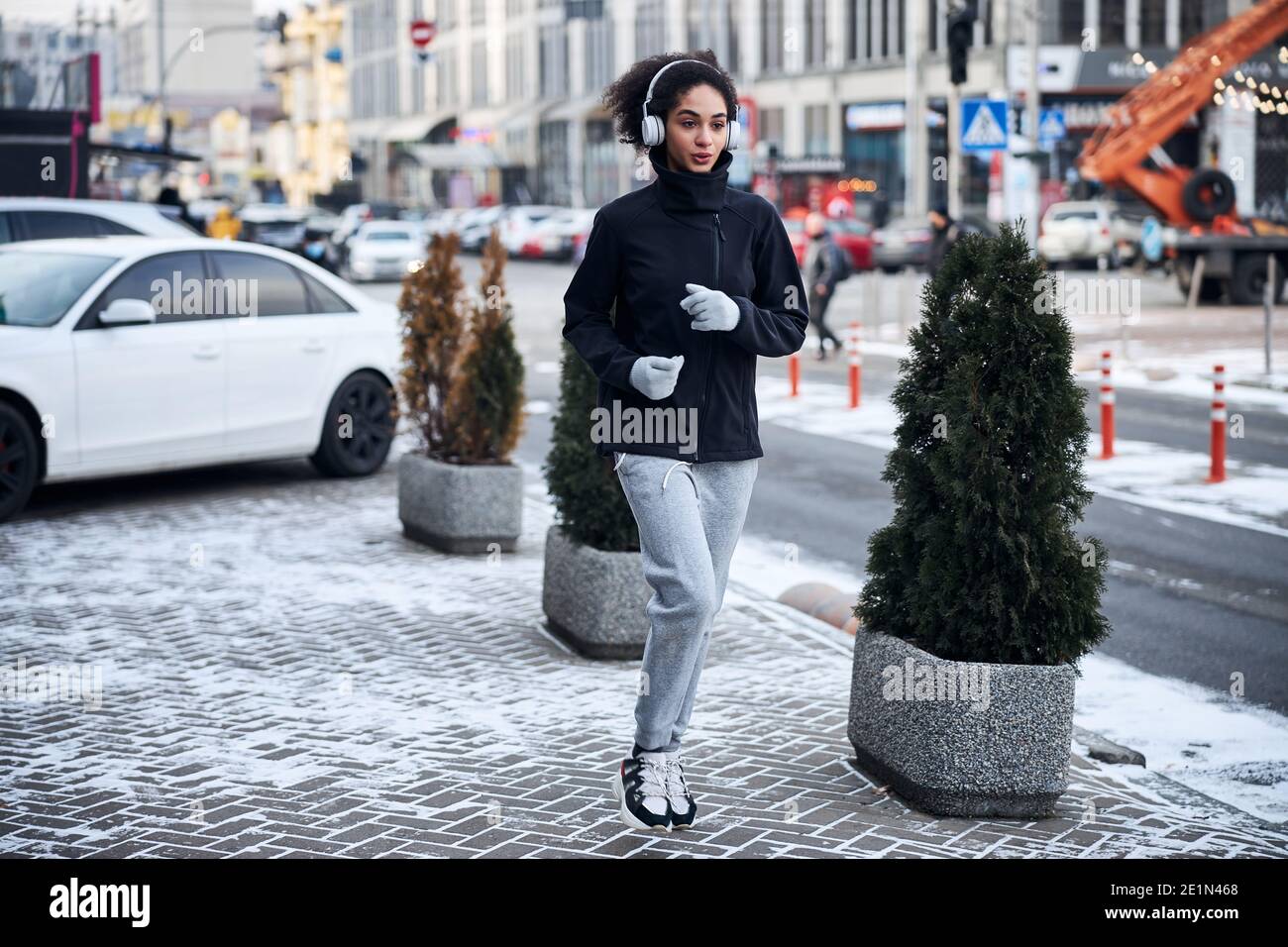Running adult moving on a street sidewalk Stock Photo - Alamy