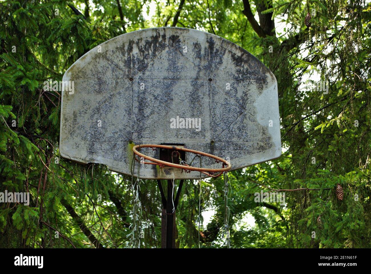very old abandoned basketball hoop that is falling apart Stock Photo ...
