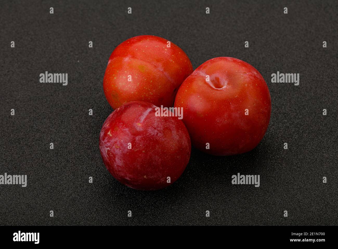 Ripe sweet tasty red plum heap Stock Photo - Alamy