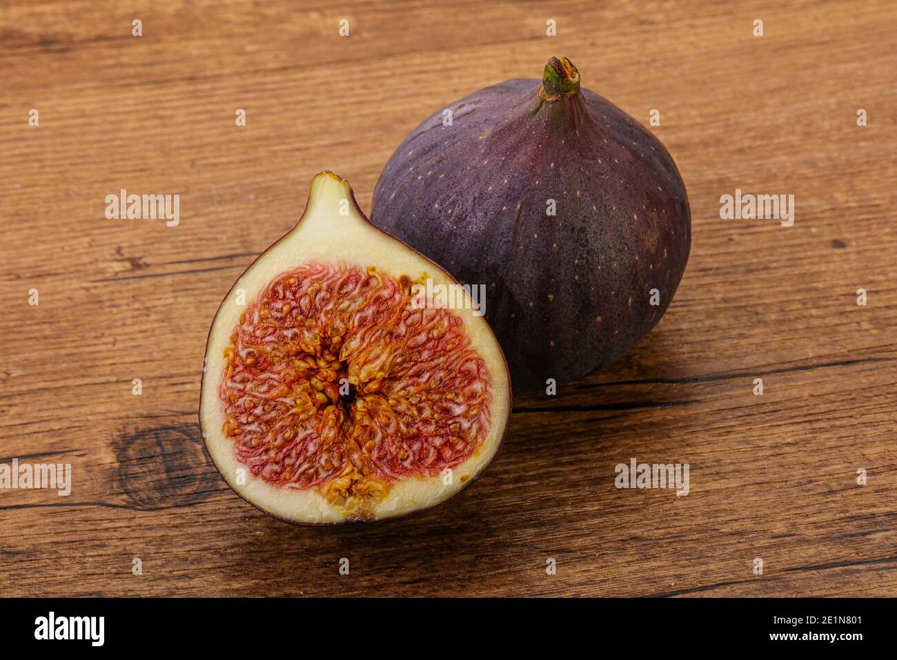 Sweet purple slice of fig fruit Stock Photo - Alamy