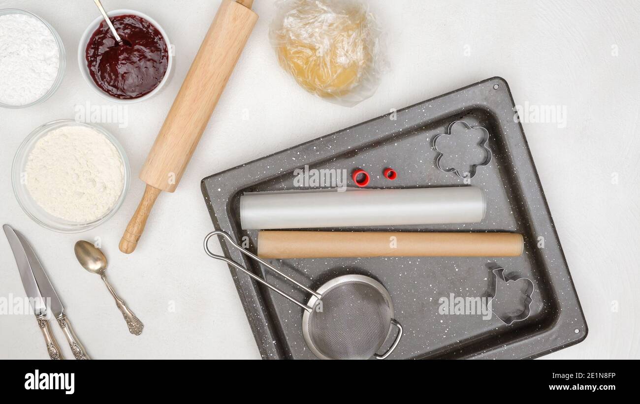 Cookies baking process. Ingredients and tools close up on kitchen table ...