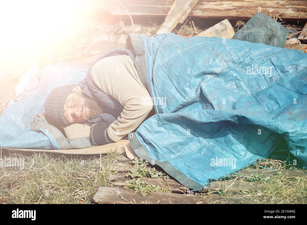 sad and upset homeless and unemployed person in ruins, economic ...