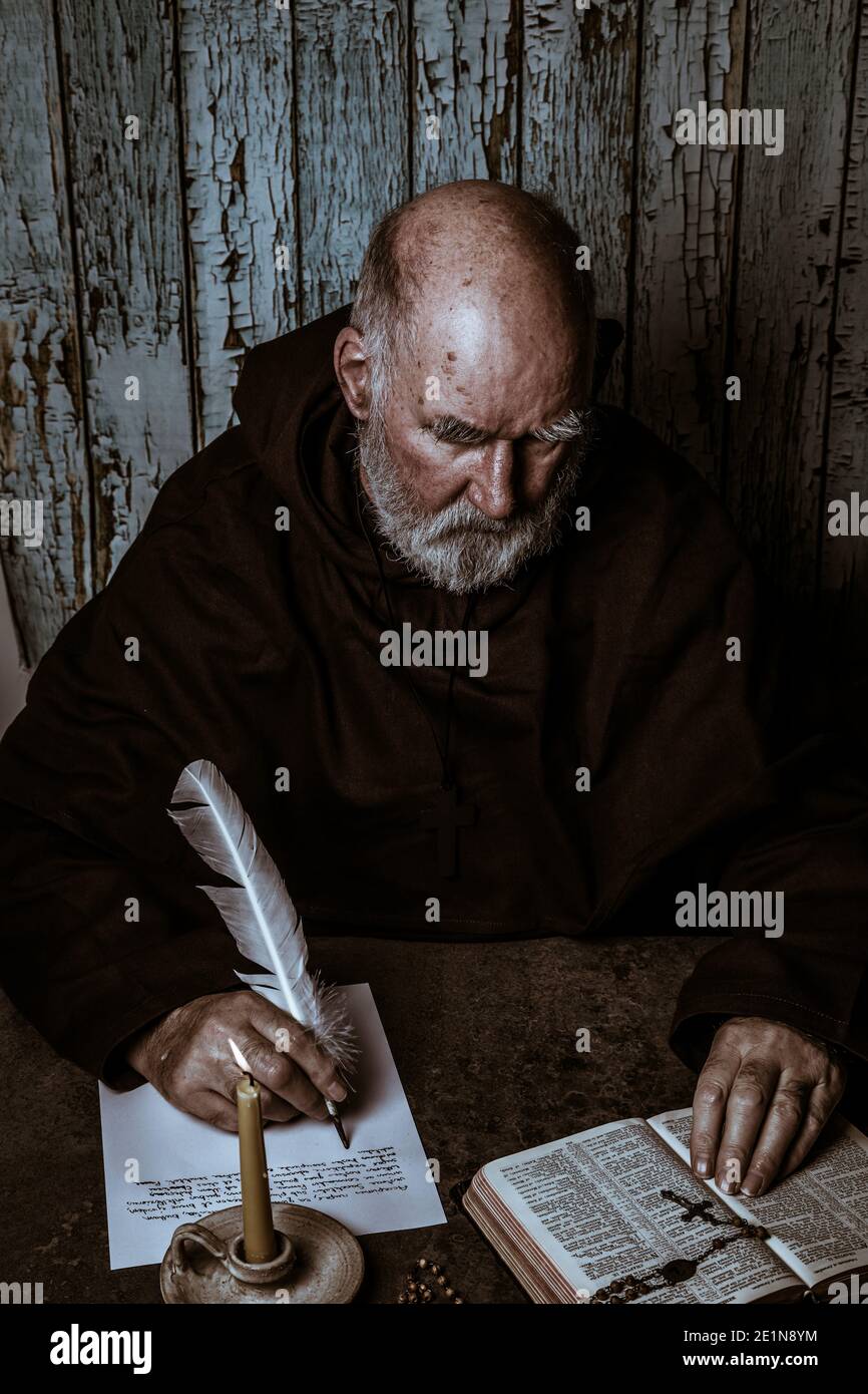 Writing monk bible hi-res stock photography and images - Alamy