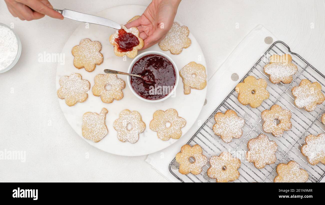 Flower shaped shortbread cookies filled with raspberry jam recipe ...
