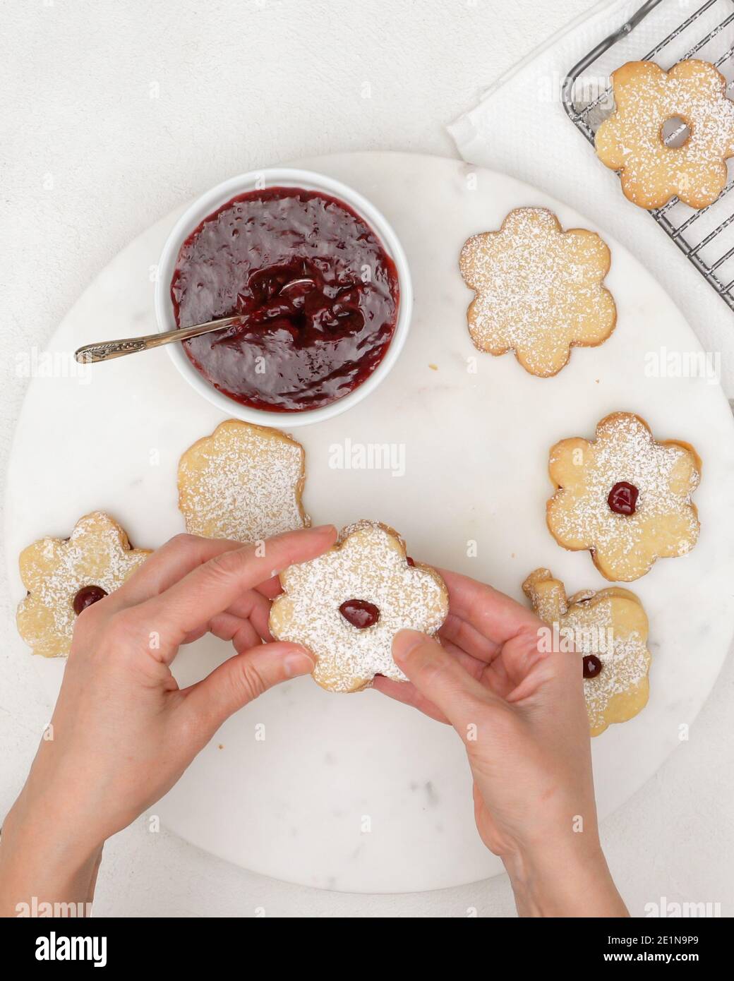 Flower shaped shortbread cookies filled with raspberry jam recipe ...