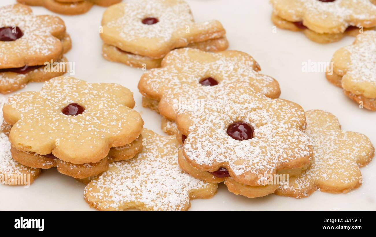 Flower shaped shortbread cookies filled with raspberry jam. Fresh baked ...