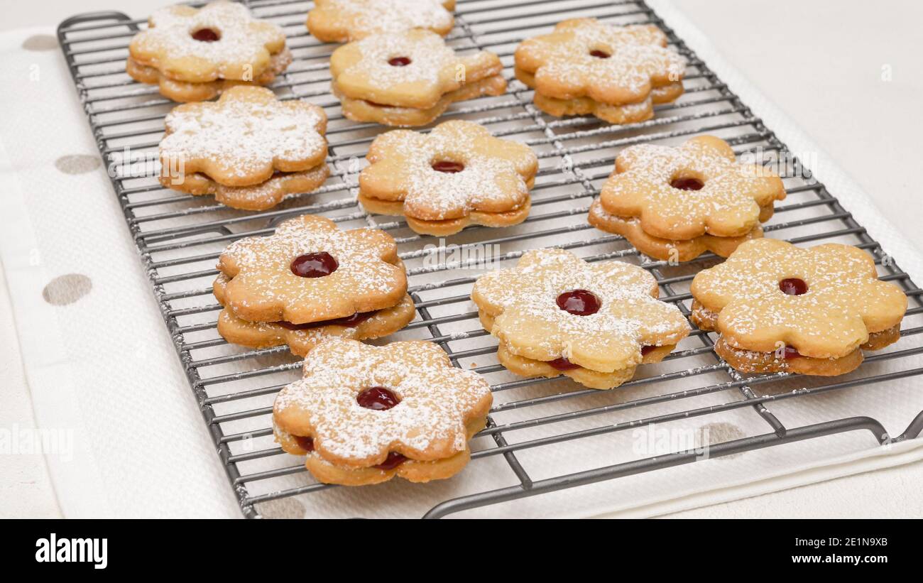 Flower shaped shortbread cookies filled with raspberry jam. Fresh baked ...