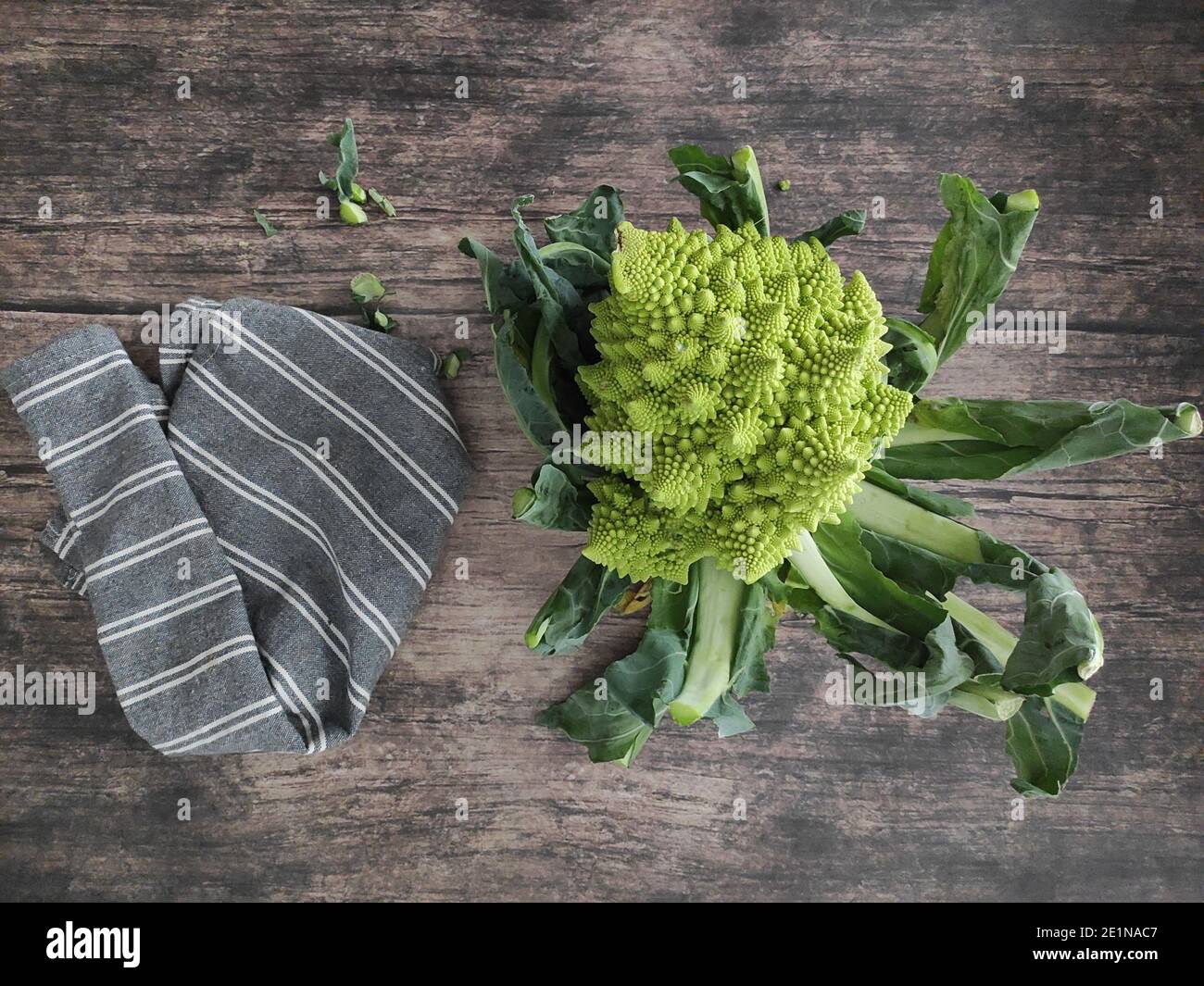 A whole romanesco broccoli on a kitchen table Stock Photo - Alamy