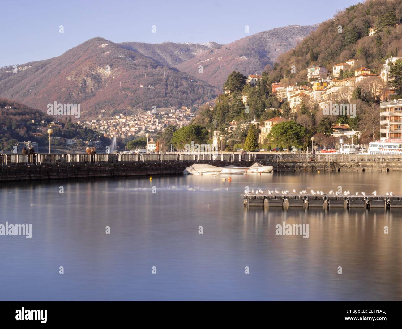 panoramic cityscape of como harbor in a mild and sunny winter day.Como ...