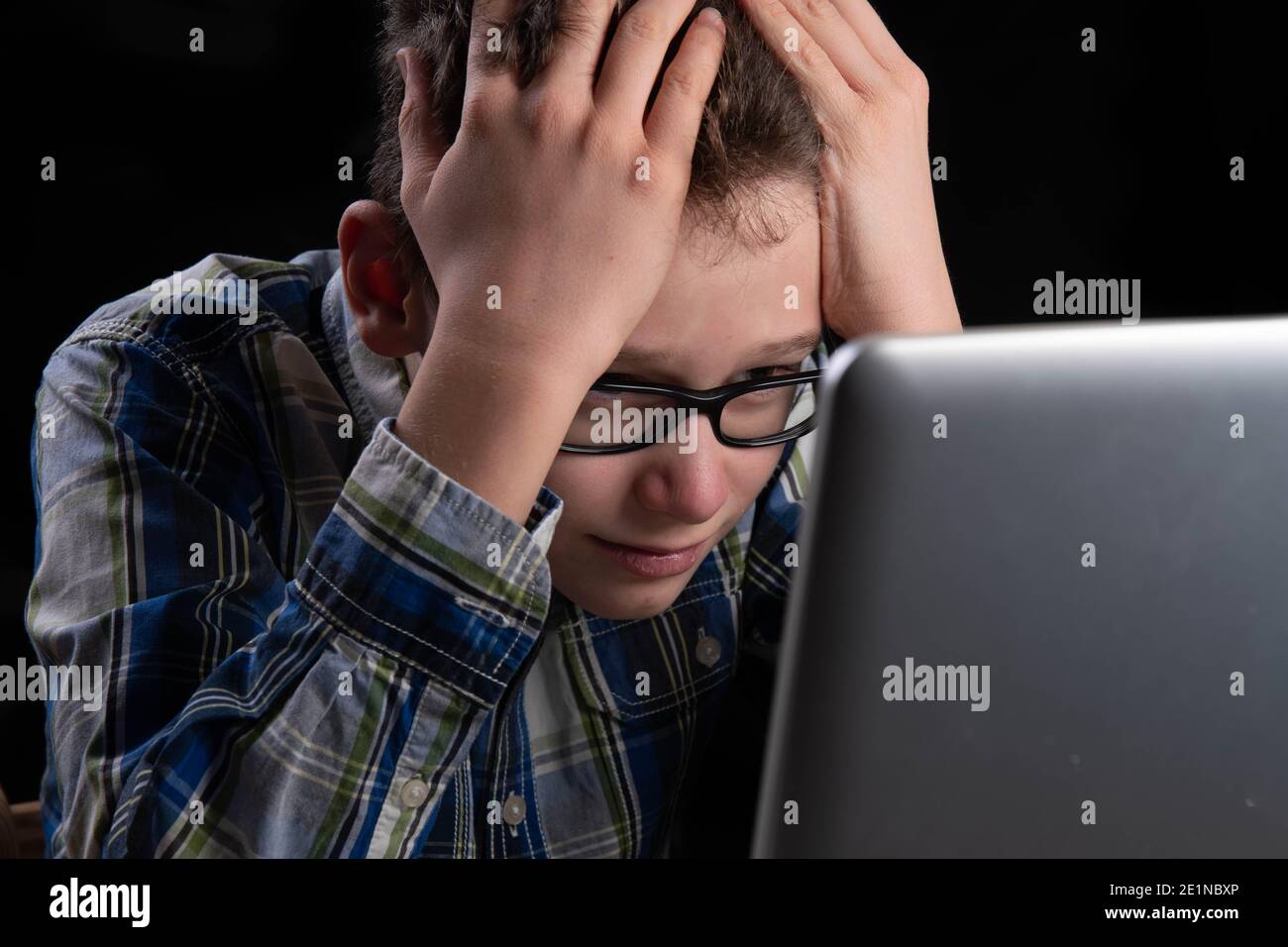 Boy exhausted and ready at computer Stock Photo - Alamy