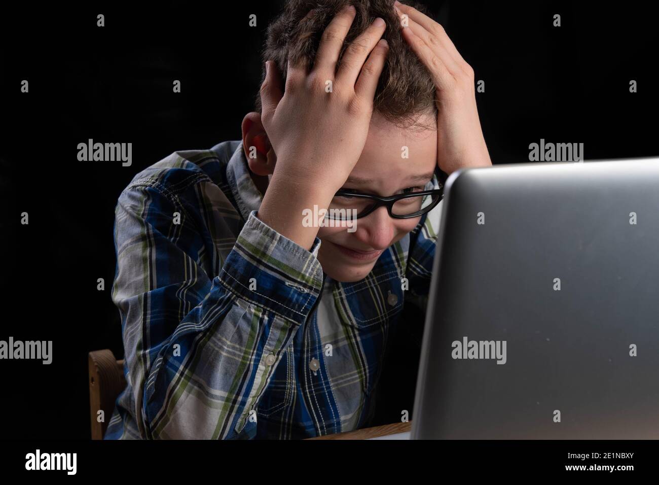 Boy exhausted and ready at computer Stock Photo - Alamy