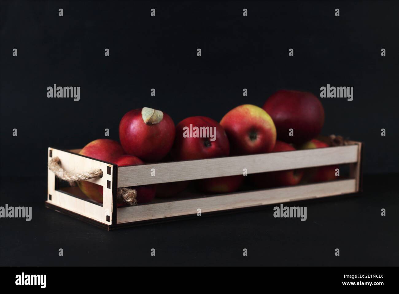 wooden box of apples isolated on black background horizontal image ...