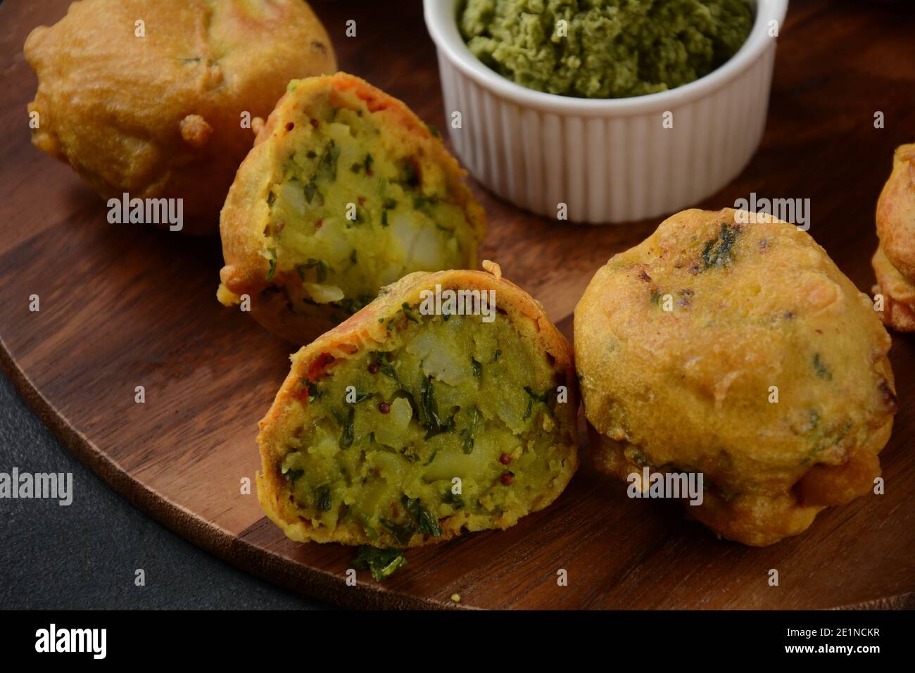Batata vada popular street food of India, Served with green chutney ...