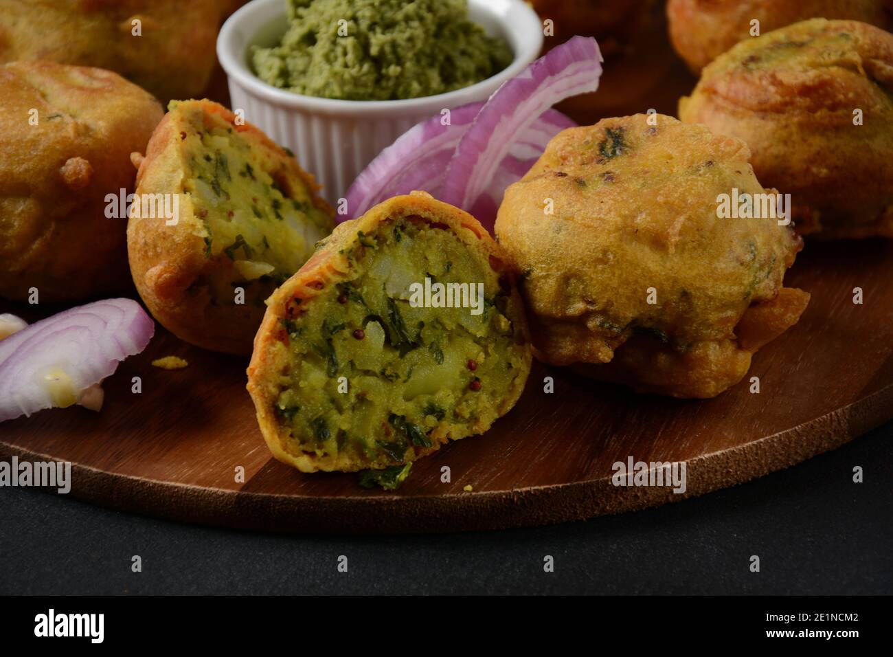 Batata vada popular street food of India, Served with green chutney ...