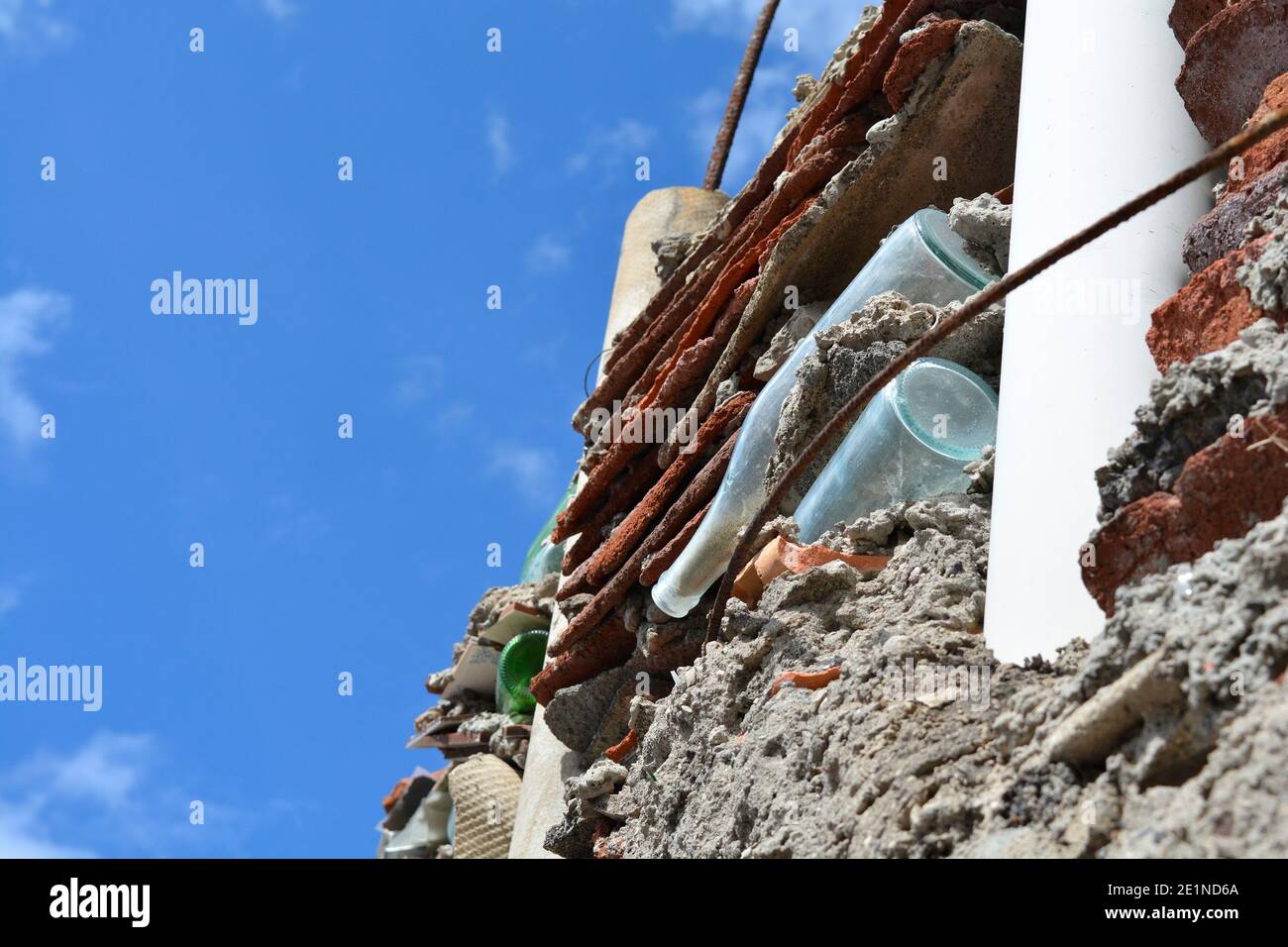 A wall that has been repaired using salvaged scrap materials Stock ...