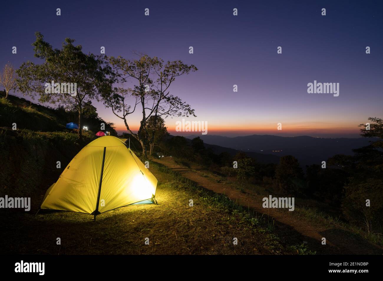 Camping tent on green grass field on mountain Stock Photo - Alamy