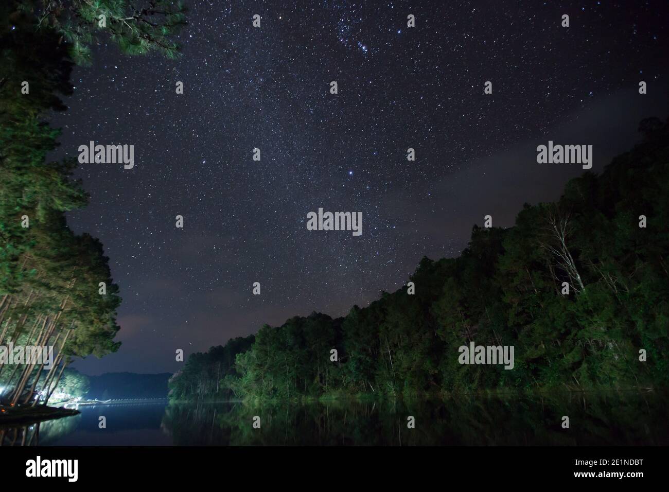 night landscape view milky way and star reflection on water in dam ...