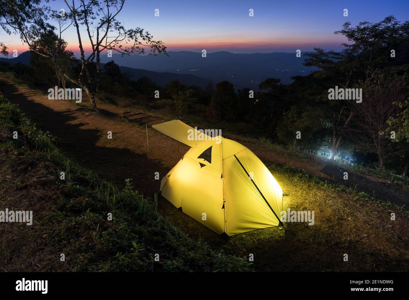 Camping tent on green grass field on mountain Stock Photo - Alamy