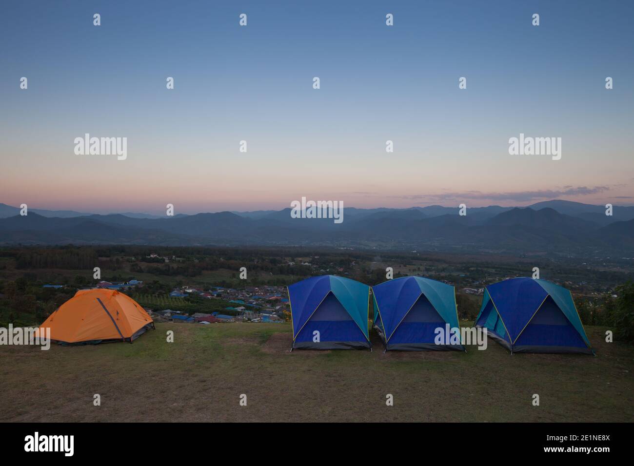 Camping tent on green grass field at mountain Stock Photo - Alamy