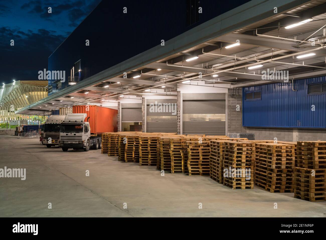 Truck is carrying container parking in front warehouse Stock Photo - Alamy