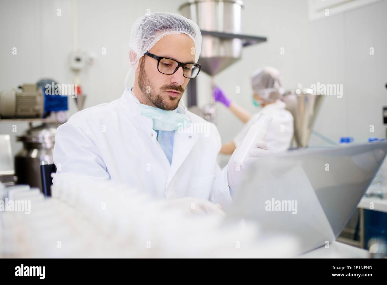 Hard working lab employee working on a computer Stock Photo - Alamy