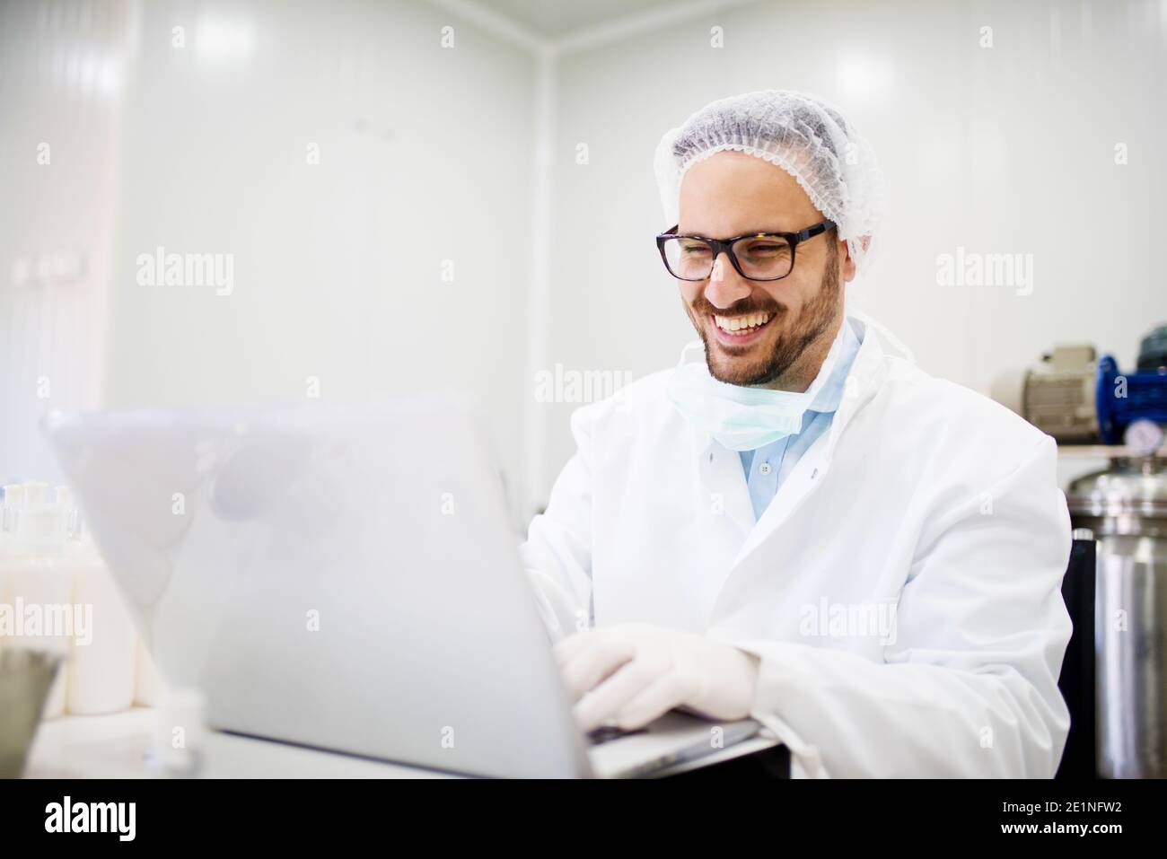 Hard working lab employee working on a computer Stock Photo - Alamy
