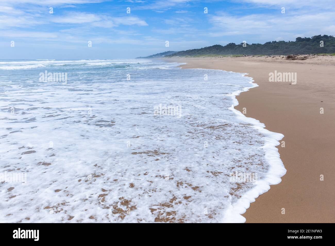 Scenic empty beach ocean sea wave foam water wash walking perspective ...
