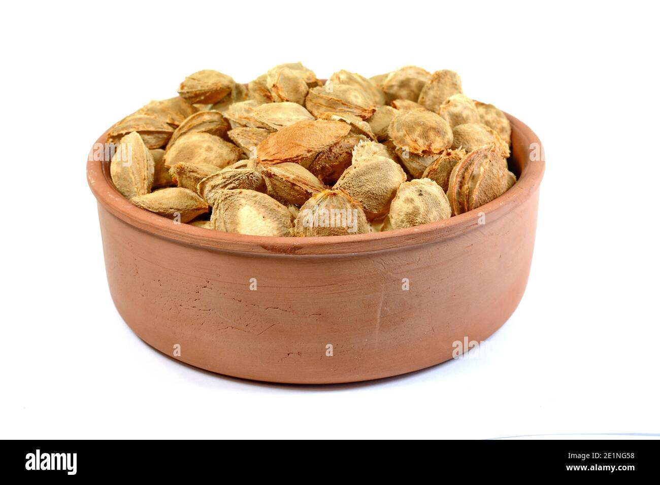 Dry apricot nut on white background Stock Photo - Alamy